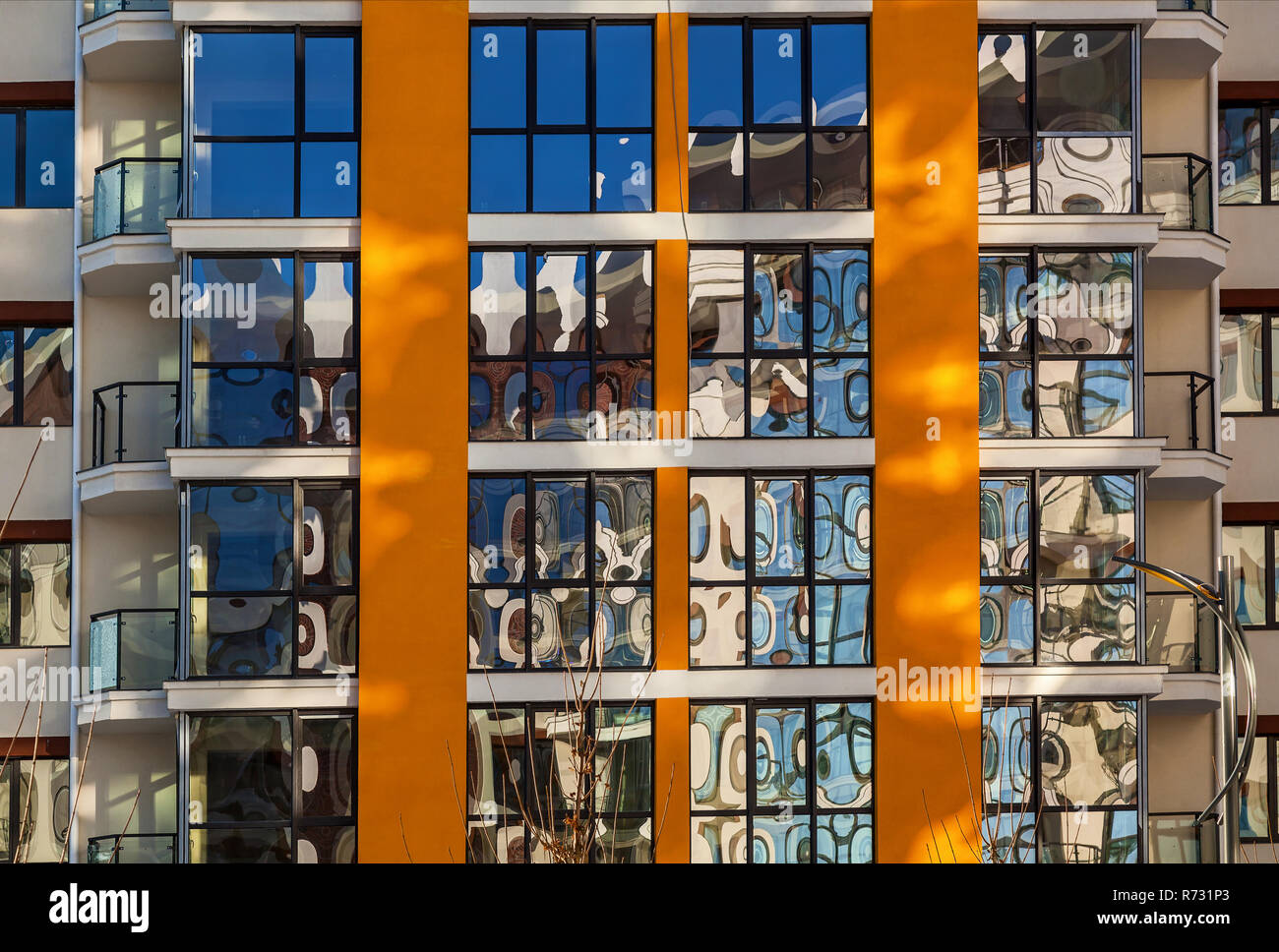 The glass facade of residential apartments in a high-rise building ...