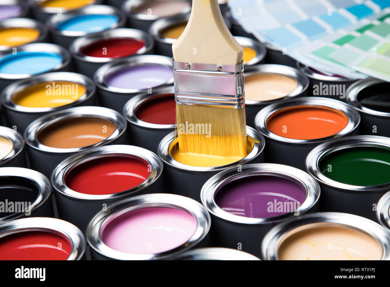 Open paint cans with a brush, Rainbow colors Stock Photo - Alamy