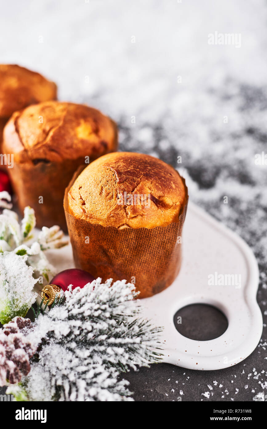 Traditional Christmas Panettone with raisins and dried fruits on white ...