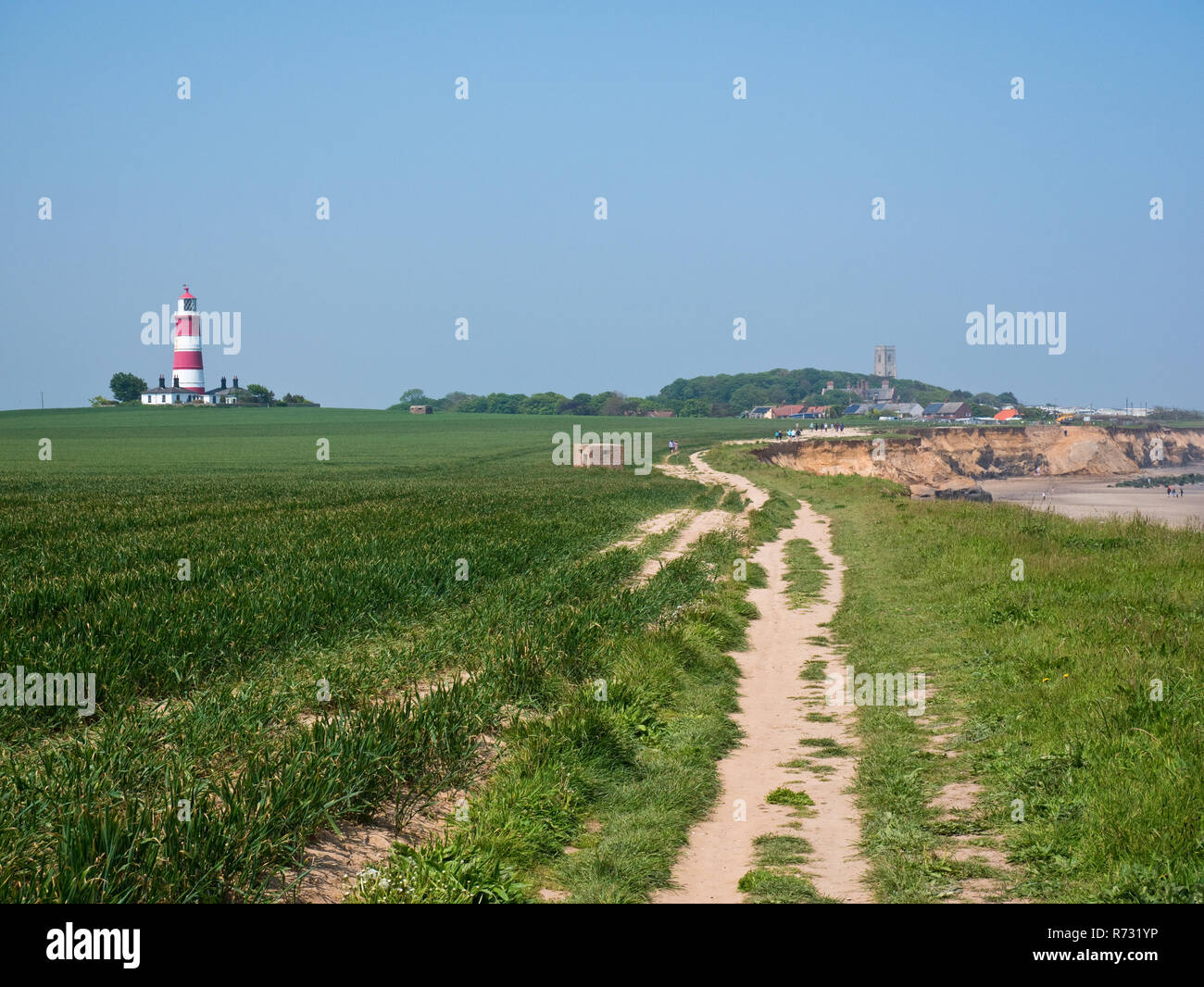 The Happisburgh lighthouse, in the Norfolk coastal village of ...