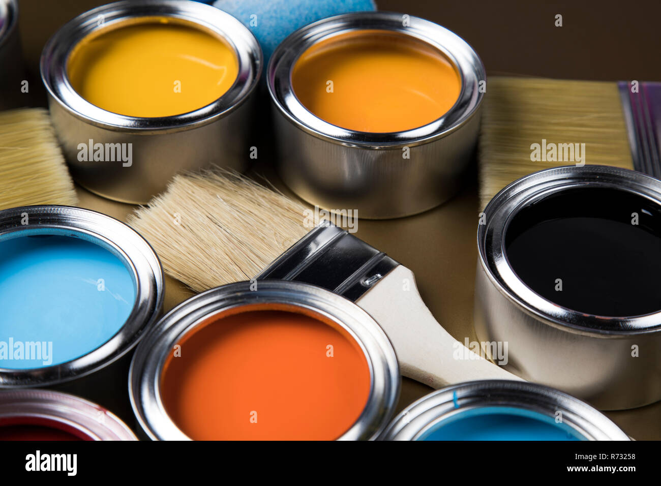 Paint brush, tin can and color guide samples Stock Photo - Alamy
