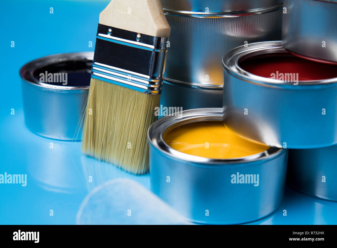 Paint brush, tin can and color guide samples Stock Photo - Alamy