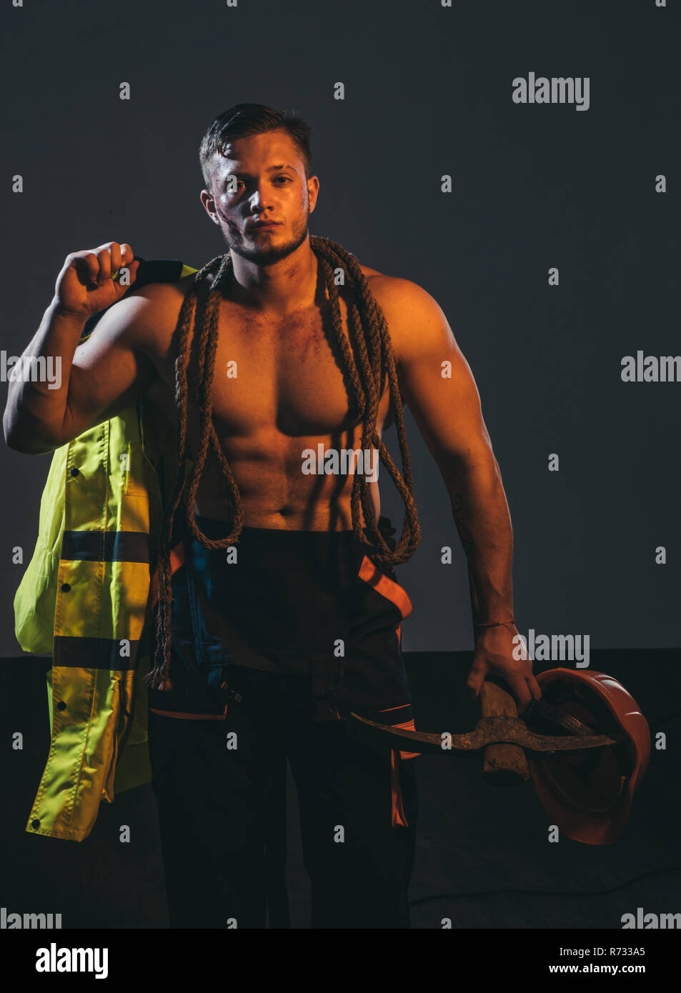 The object is under construction. Muscular man worker. Hard worker with ...