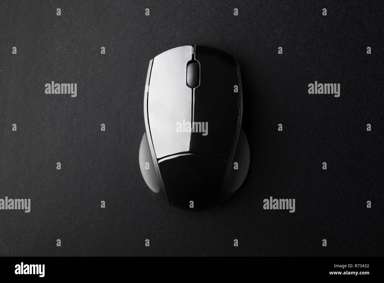 Black Wireless Optical Mouse on Black Surface Seen from Above Stock ...
