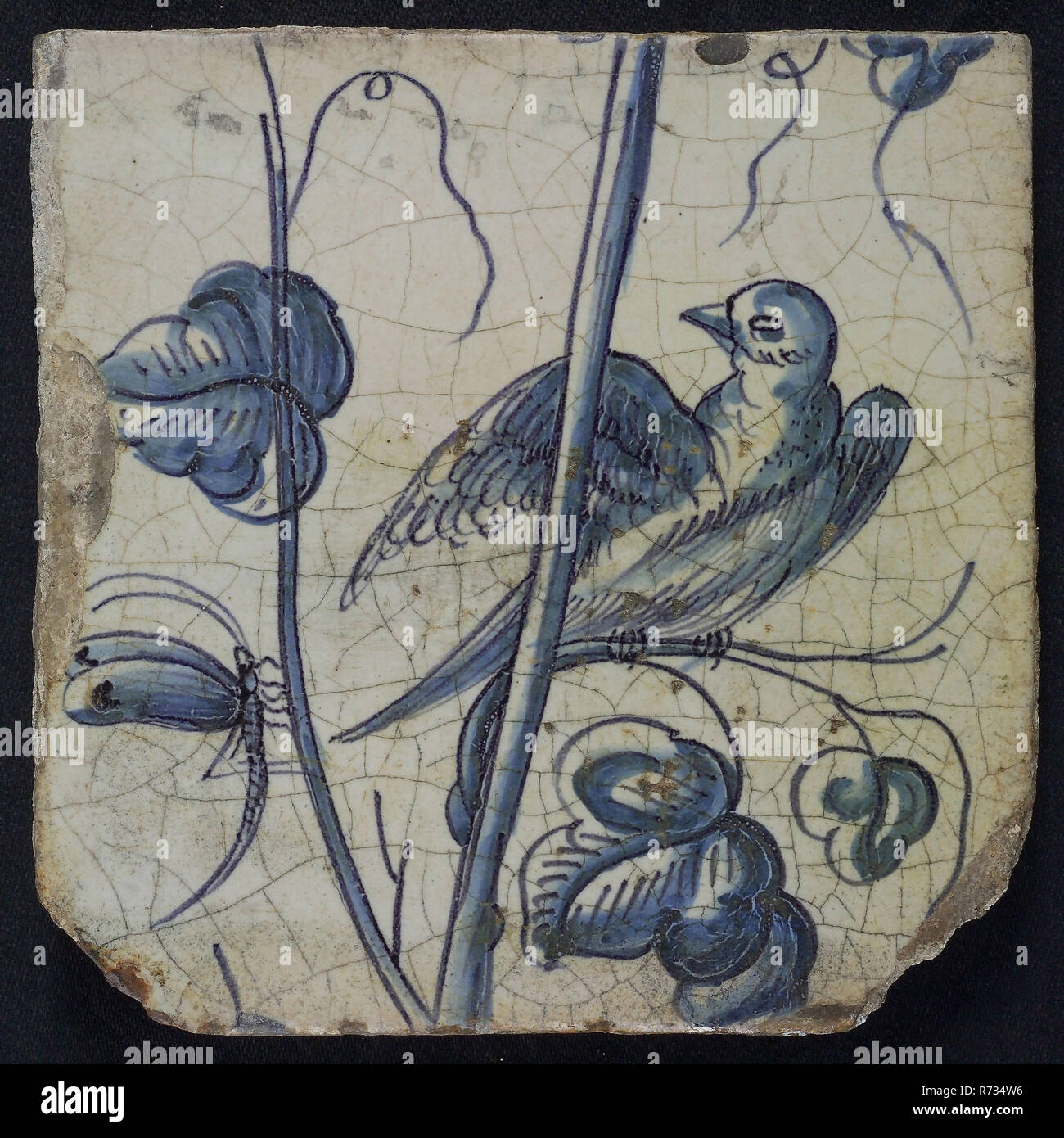 Blue tile with looking bird to dragonfly, on grape leaf of chimney ...