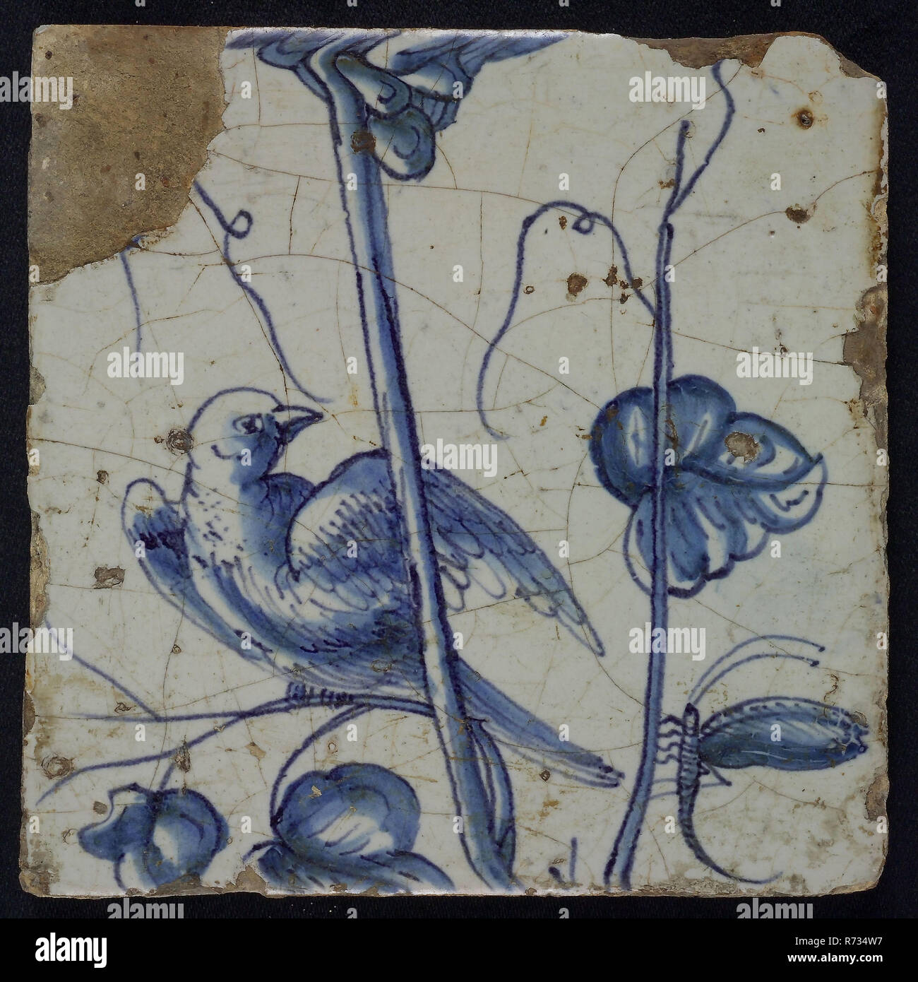 Blue tile with looking bird to dragonfly, on grape leaf of chimney ...