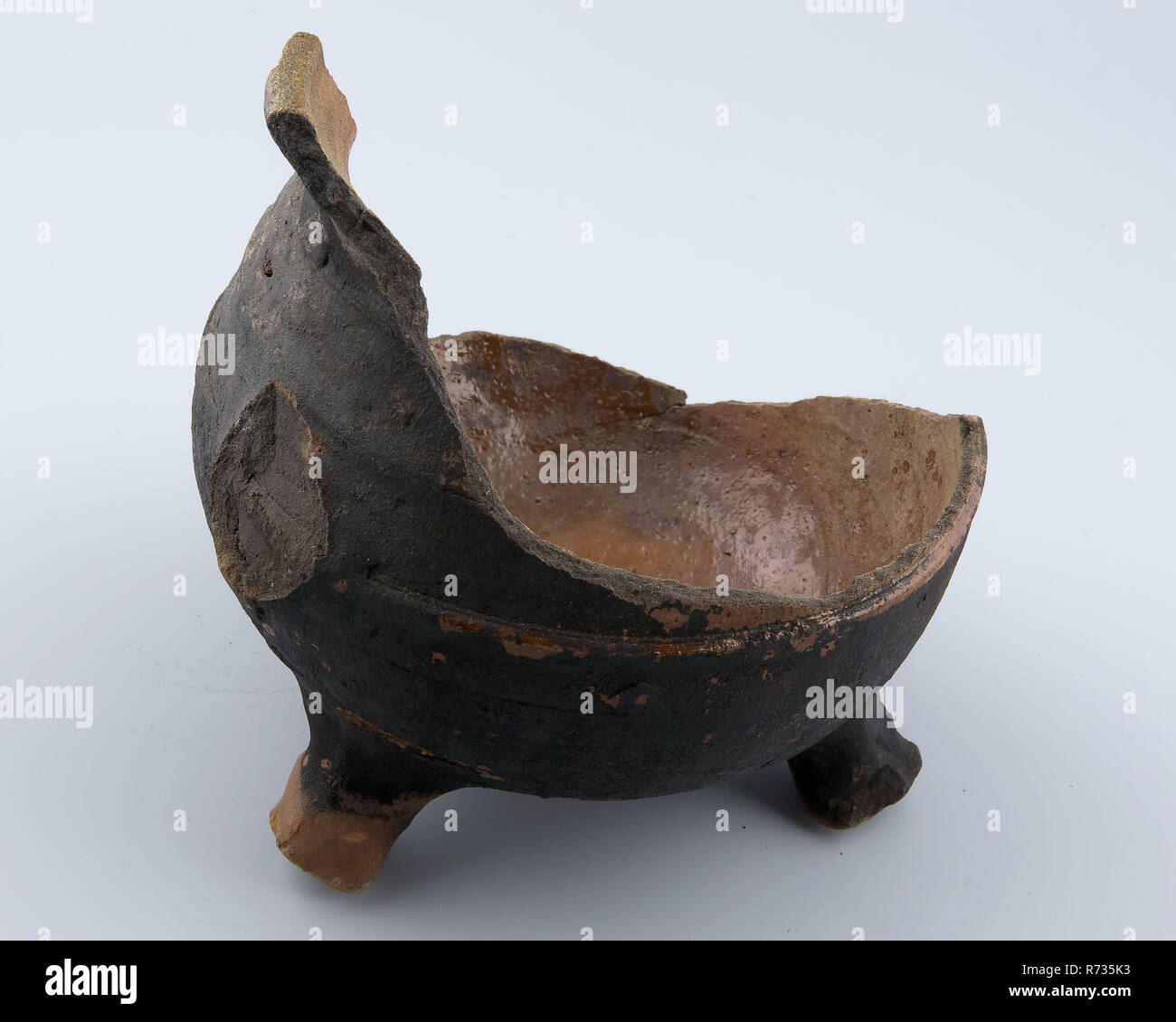 Fragment of the cooking jug on three legs, grape cooking pot crockery ...