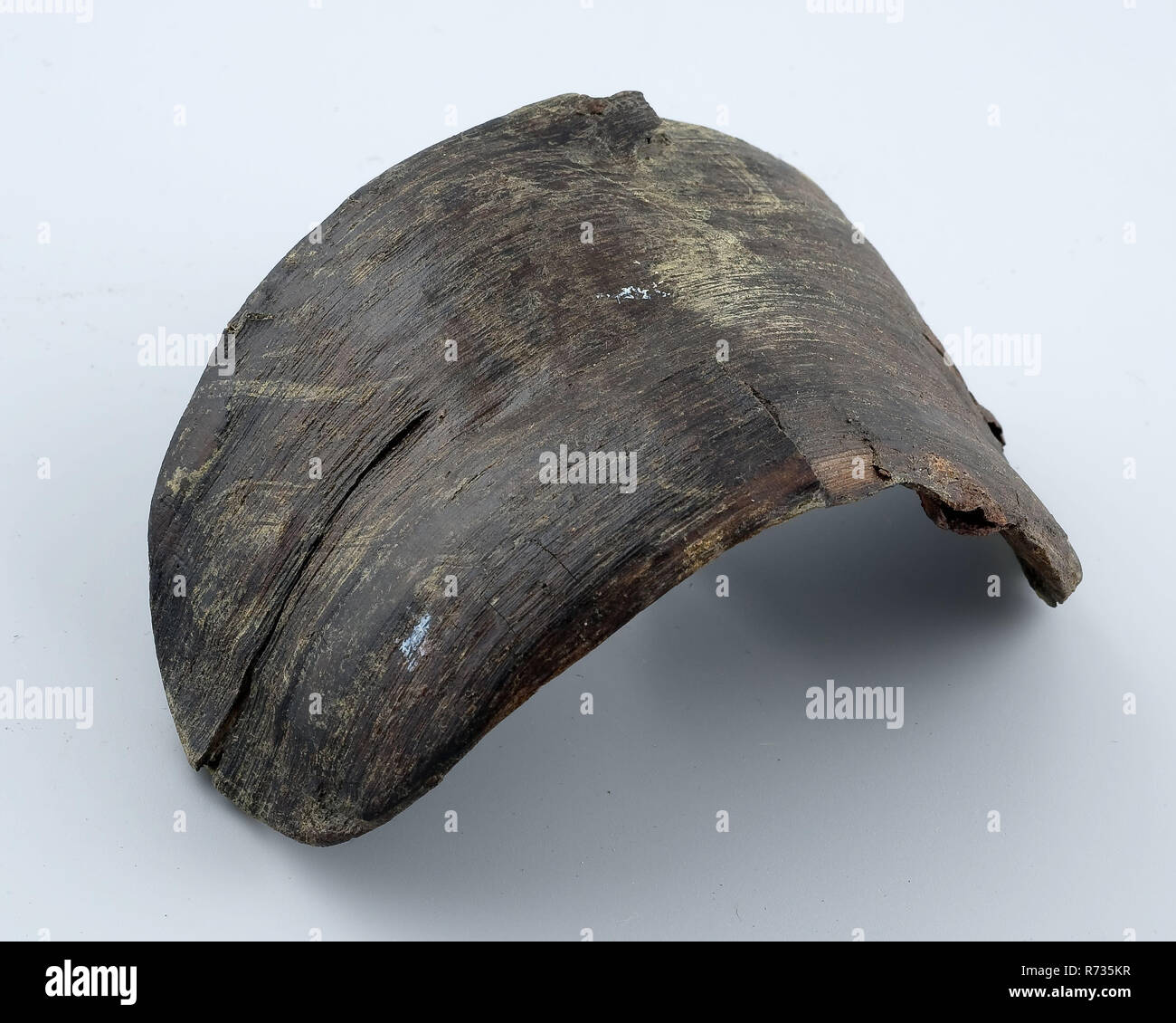 Wooden bottom of small tub or basket, oval in shape, component ground ...