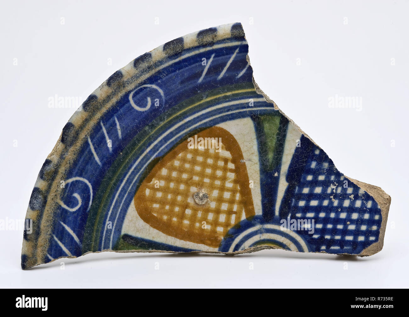 Fragment majolica plate with polychrome leaf motifs and sgraffito in ...