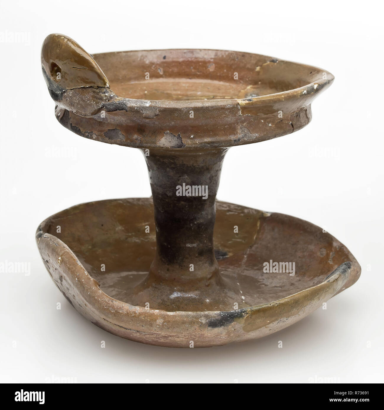 Earthenware oil lamp, reservoir on trunk, with spout and suspension eye ...