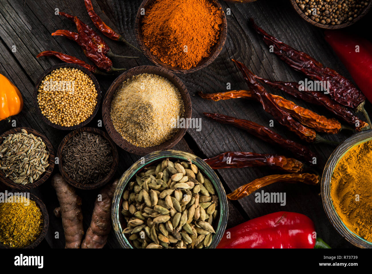 Wooden bowl, Hot spices Stock Photo - Alamy