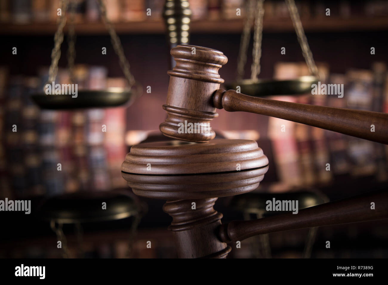 Law theme, mallet of judge, wooden gavel, mirror reflection background ...