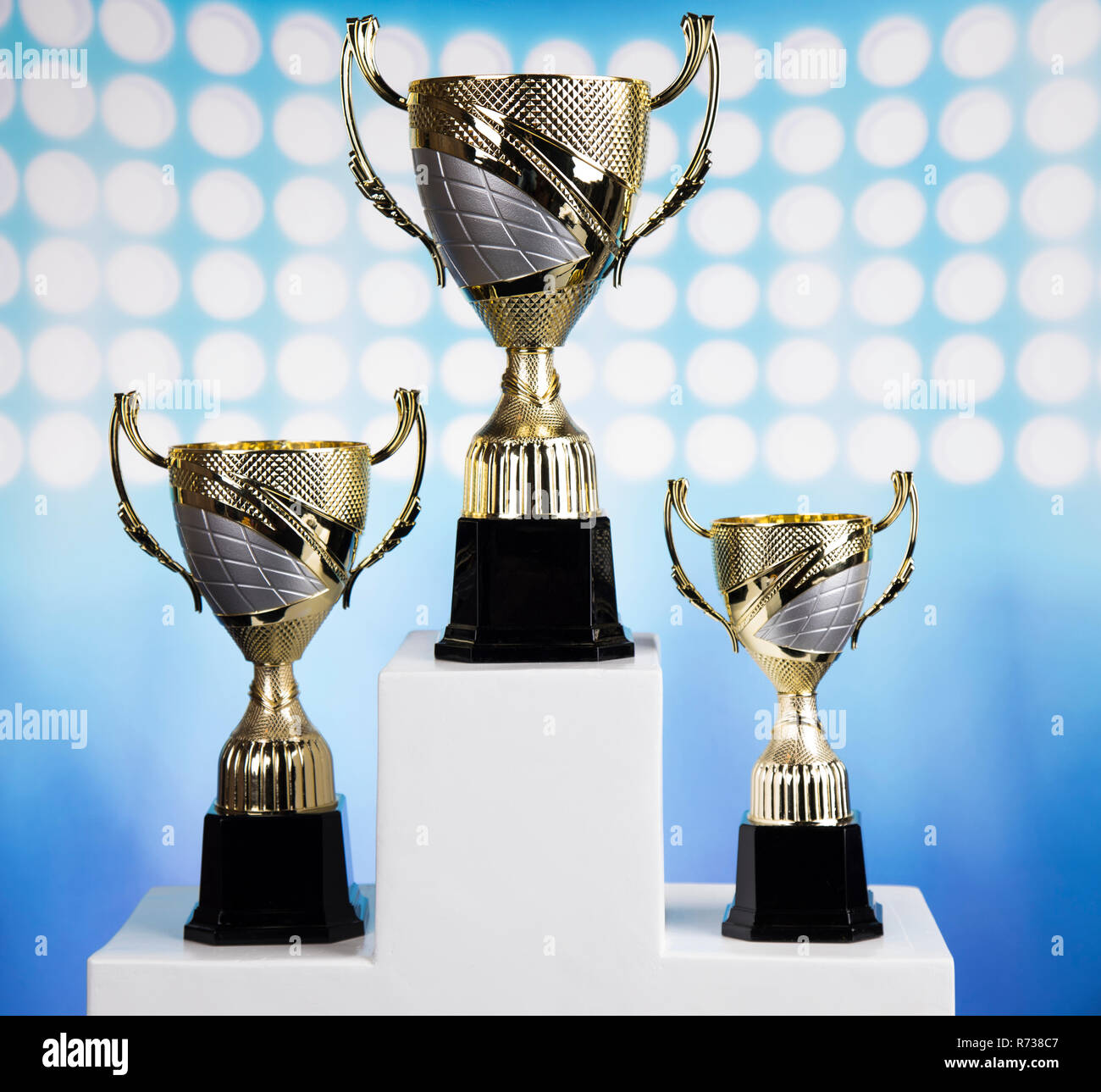 Sport podium, Cups of winners award Stock Photo - Alamy