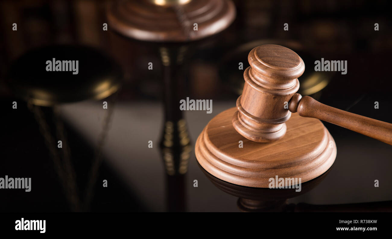 Law theme, mallet of judge, wooden gavel, mirror reflection background ...
