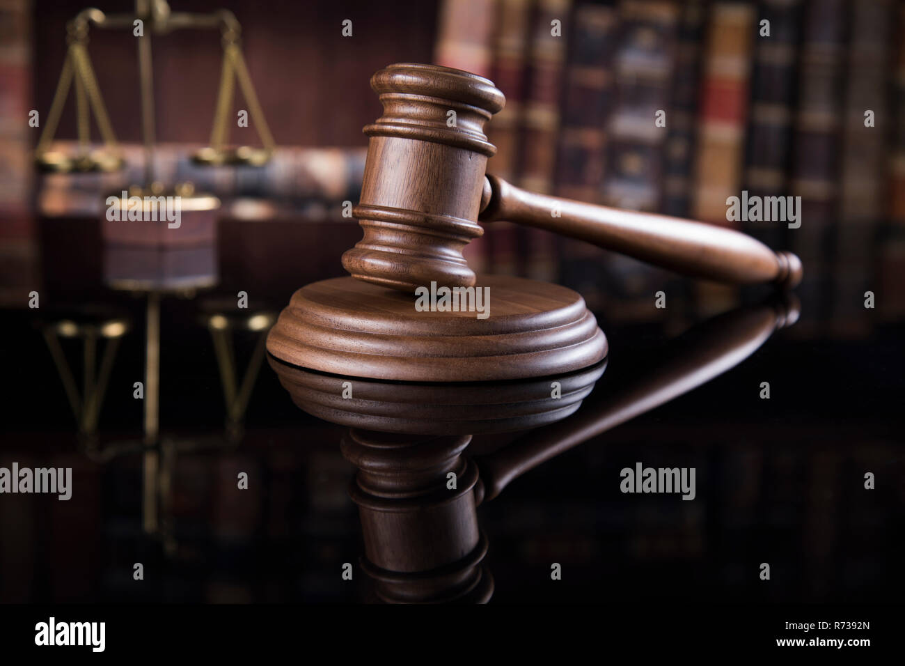 Law theme, mallet of judge, wooden gavel, mirror reflection background ...