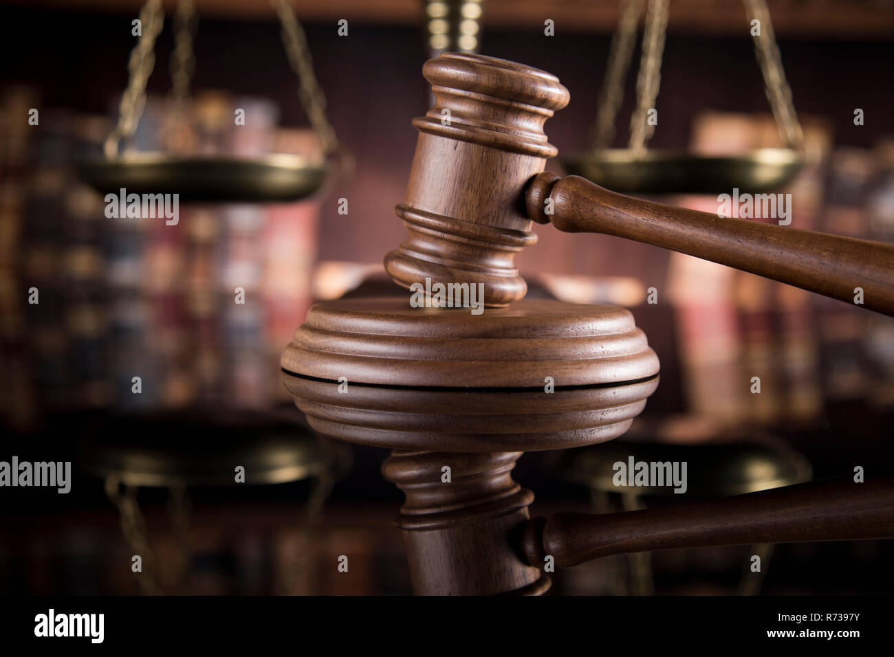 Law theme, mallet of judge, wooden gavel, mirror reflection background ...