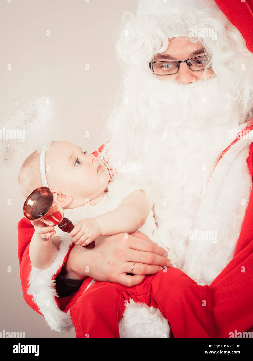 Christmas time people concept. Santa claus with little baby. Man has ...