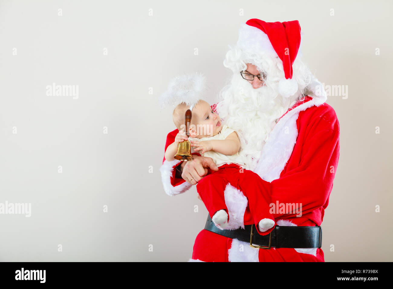 Christmas family holiday concept. Father wearing santa claus hat ...