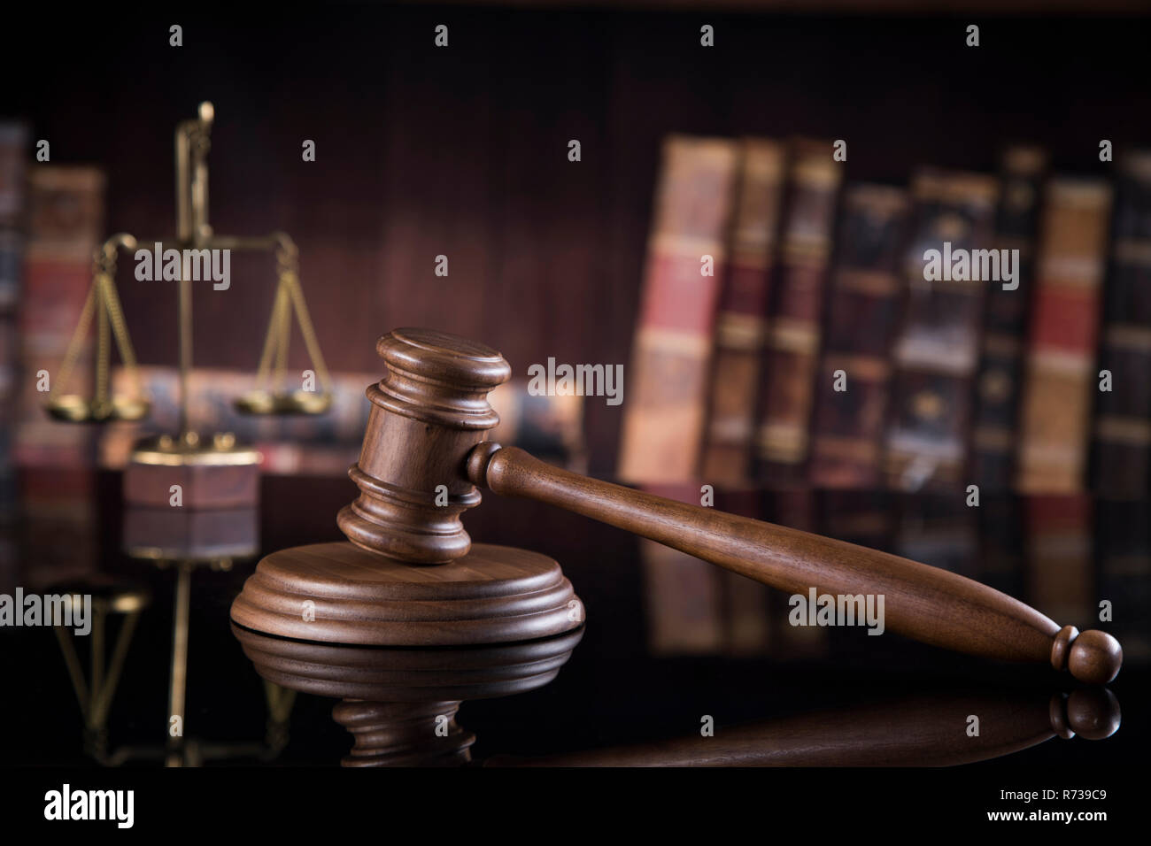 Law theme, mallet of judge, wooden gavel, mirror reflection background ...