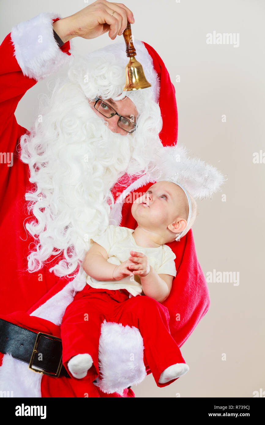 Christmas time people concept. Santa claus with little baby. Man has ...