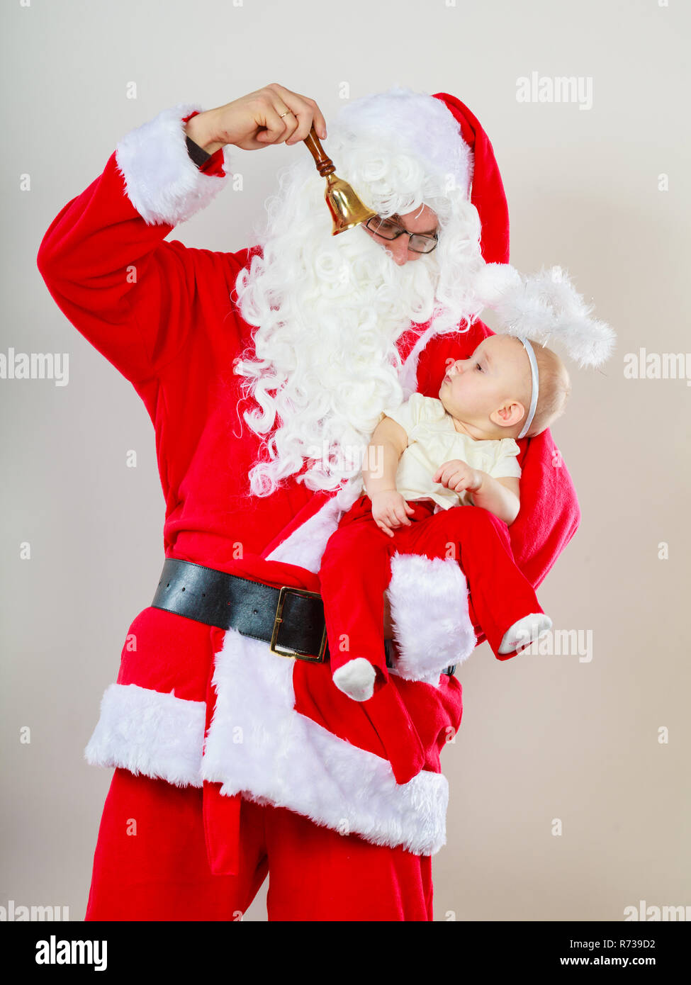 Christmas family holiday concept. Father wearing santa claus hat ...
