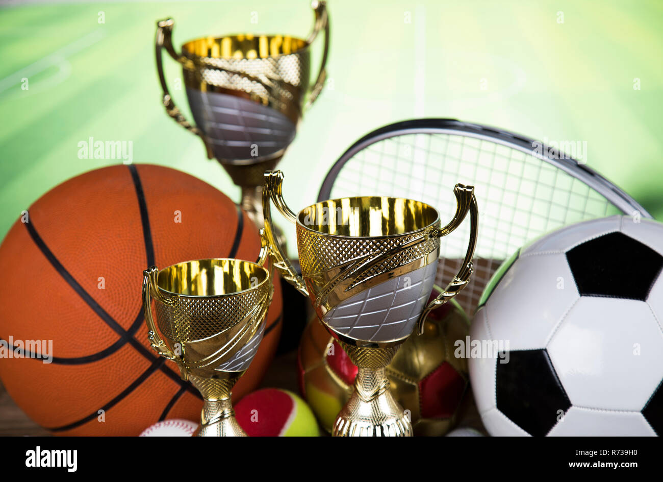 Winner trophy, Sport equipment and balls Stock Photo - Alamy