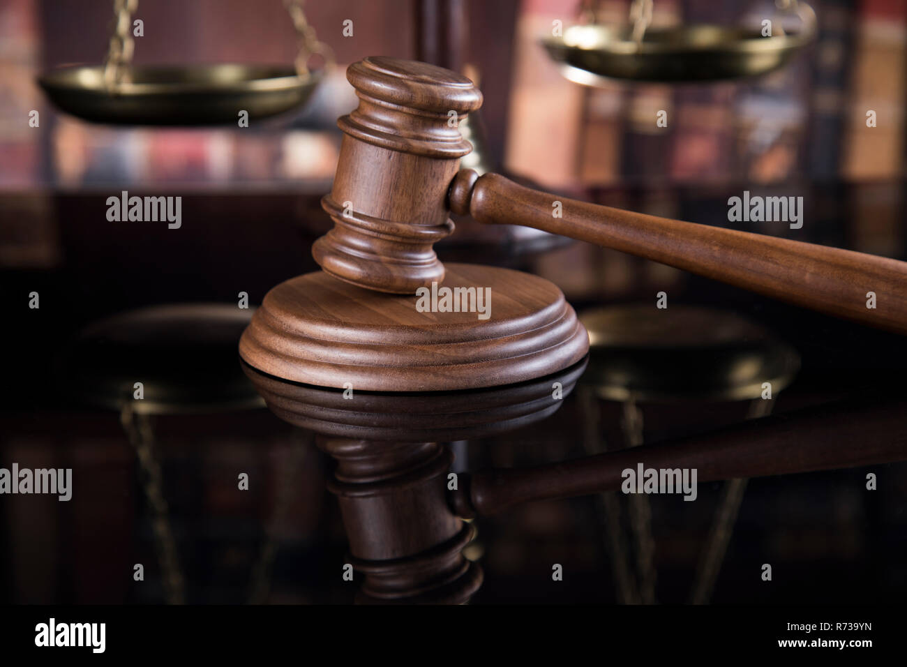 Law theme, mallet of judge, wooden gavel, mirror reflection background ...