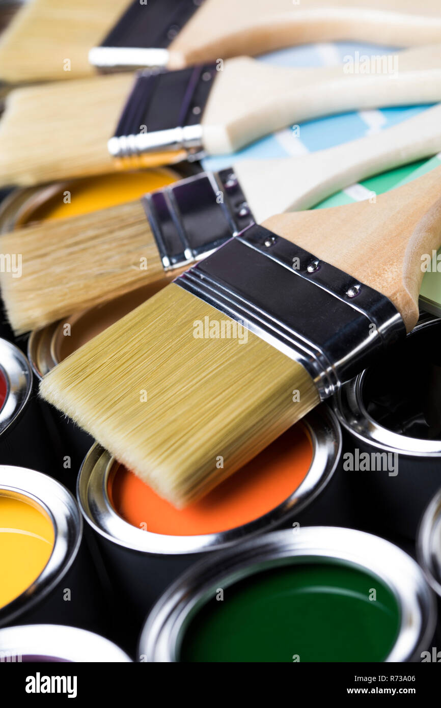 Paint brush, tin can and color guide samples Stock Photo - Alamy