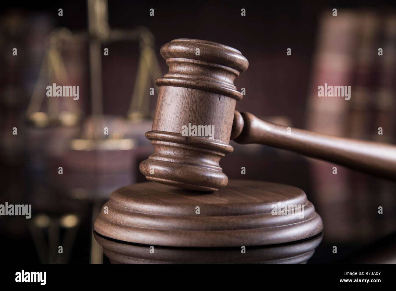 Law theme, mallet of judge, wooden gavel, mirror reflection background ...