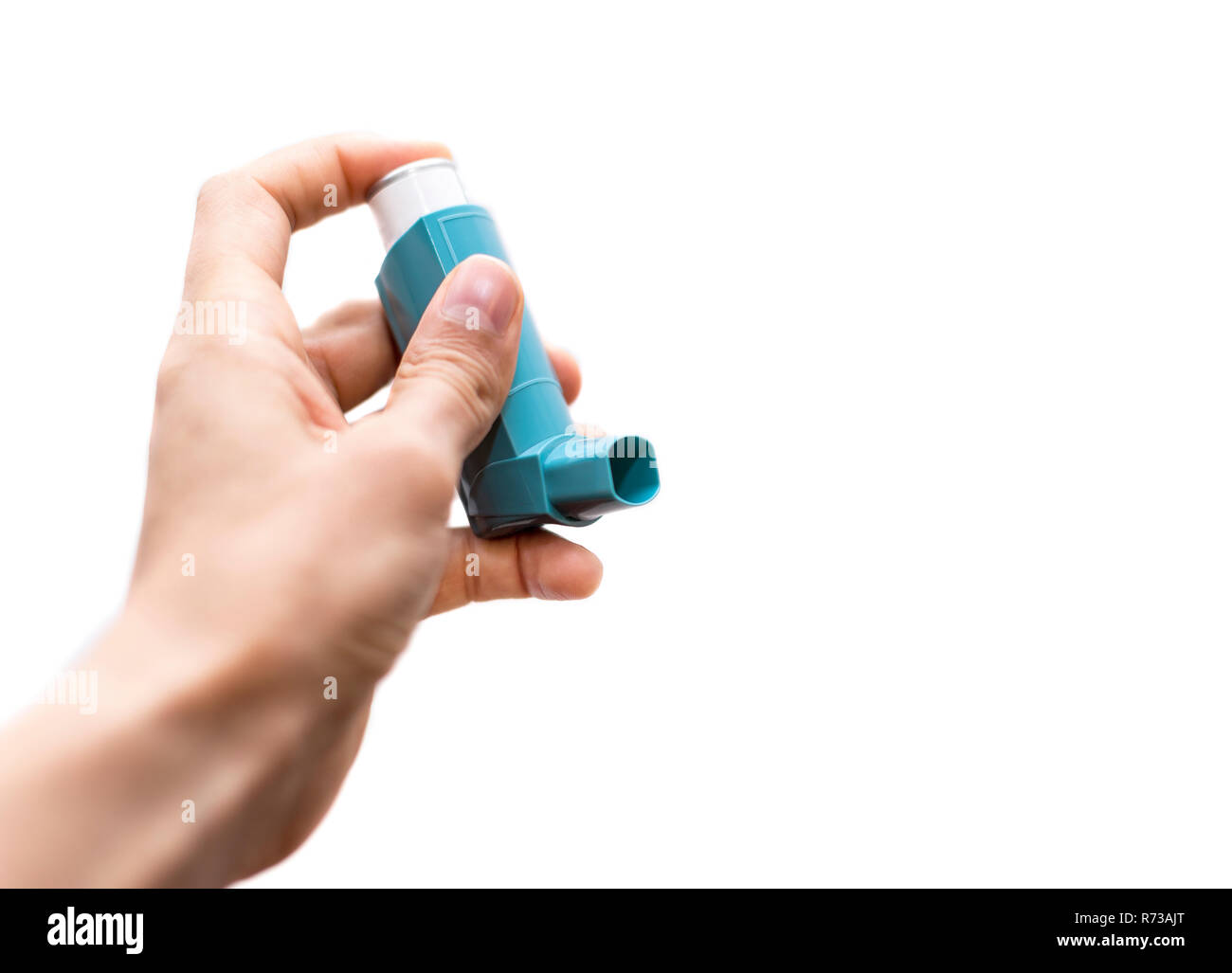 Caucasian man with asthma spray in hand over the white isolated ...