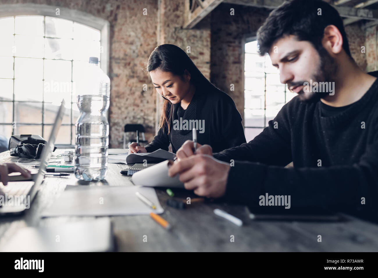 Designers brainstorming in studio Stock Photo - Alamy