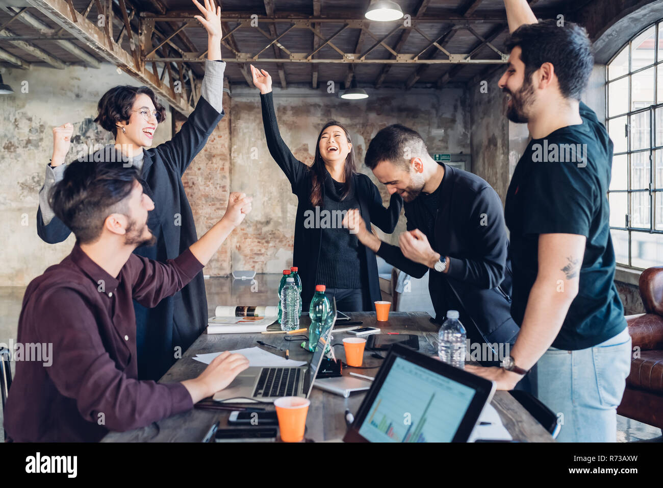 Young woman celebrating success using hi-res stock photography and ...