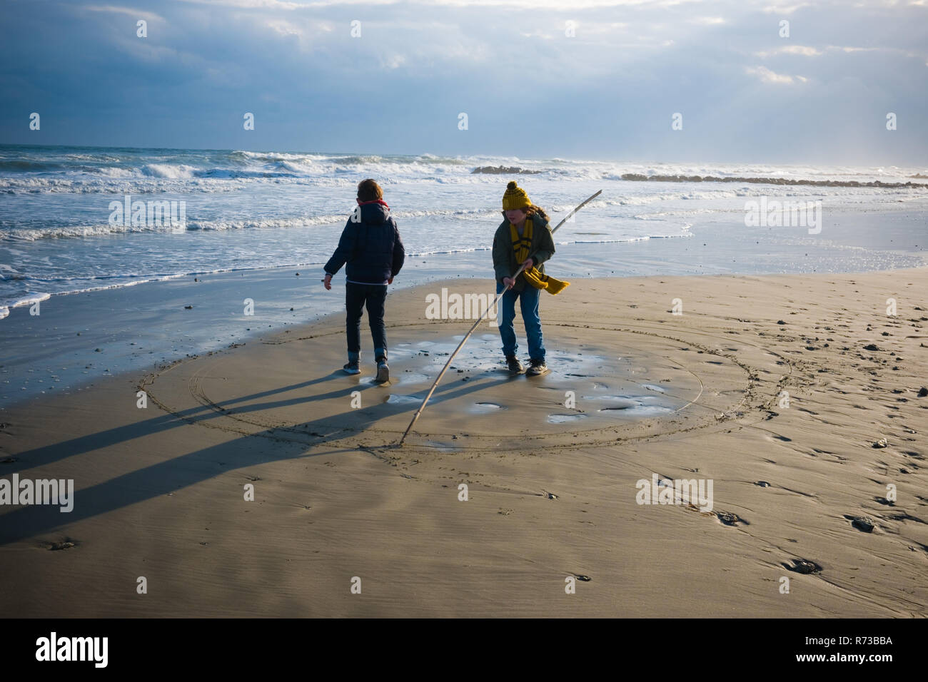 Stick Drawing In The Sand High Resolution Stock Photography and Images ...