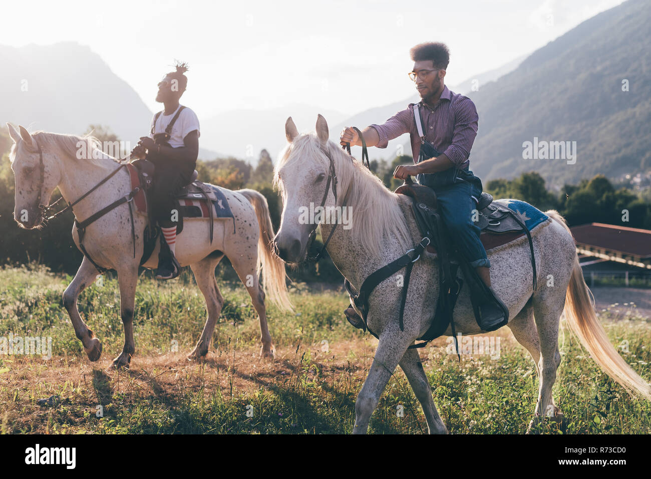 Two men sharing horse hi-res stock photography and images - Alamy