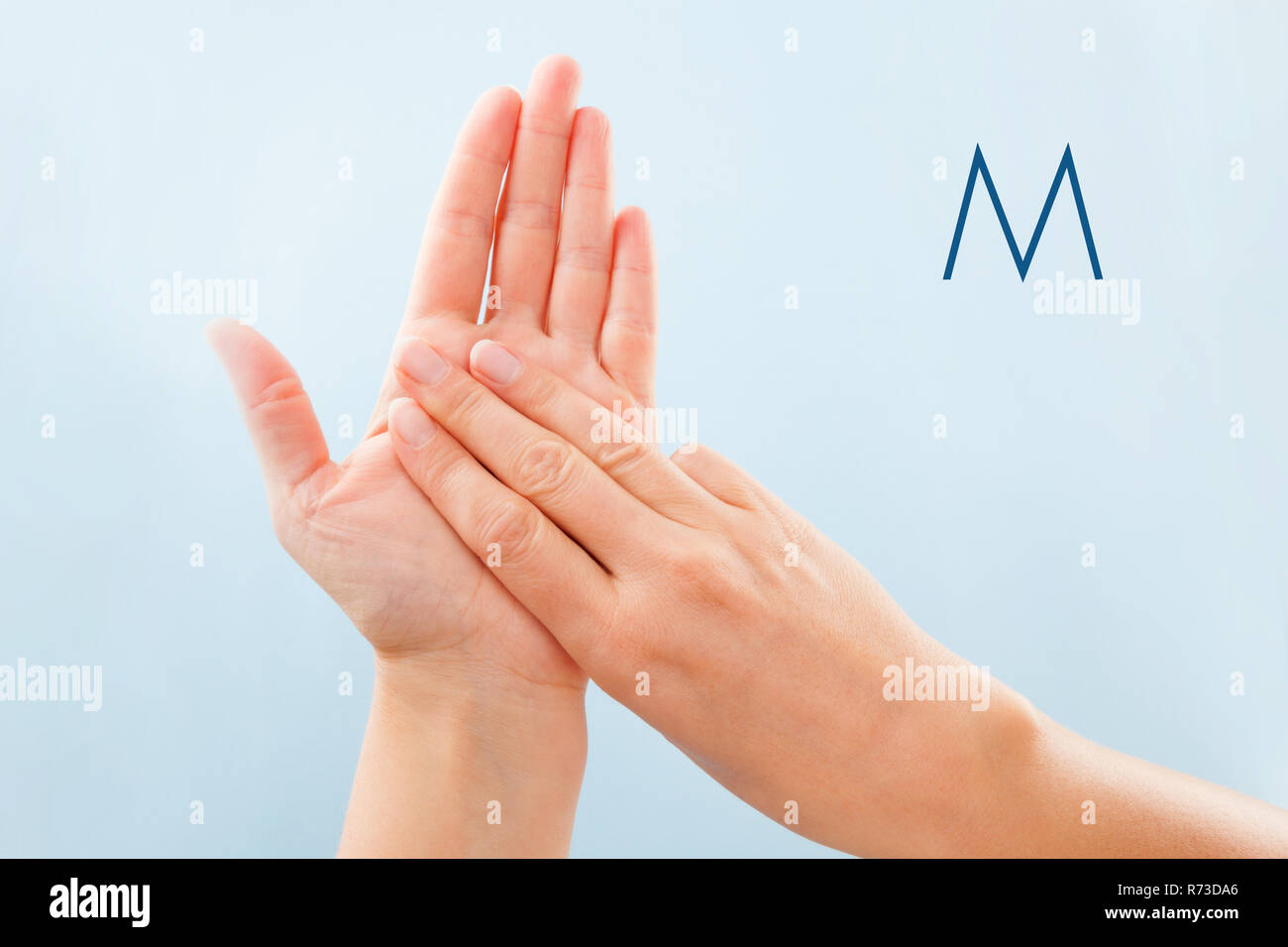 BSL Fingerspelling alphabet M Stock Photo - Alamy
