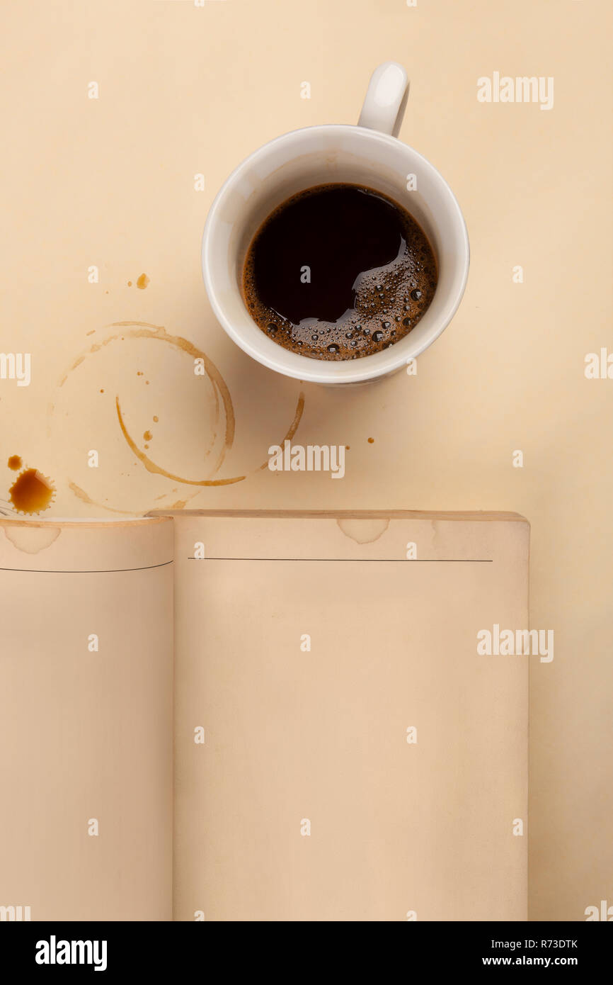 Cup of coffee with empty notebook Stock Photo - Alamy