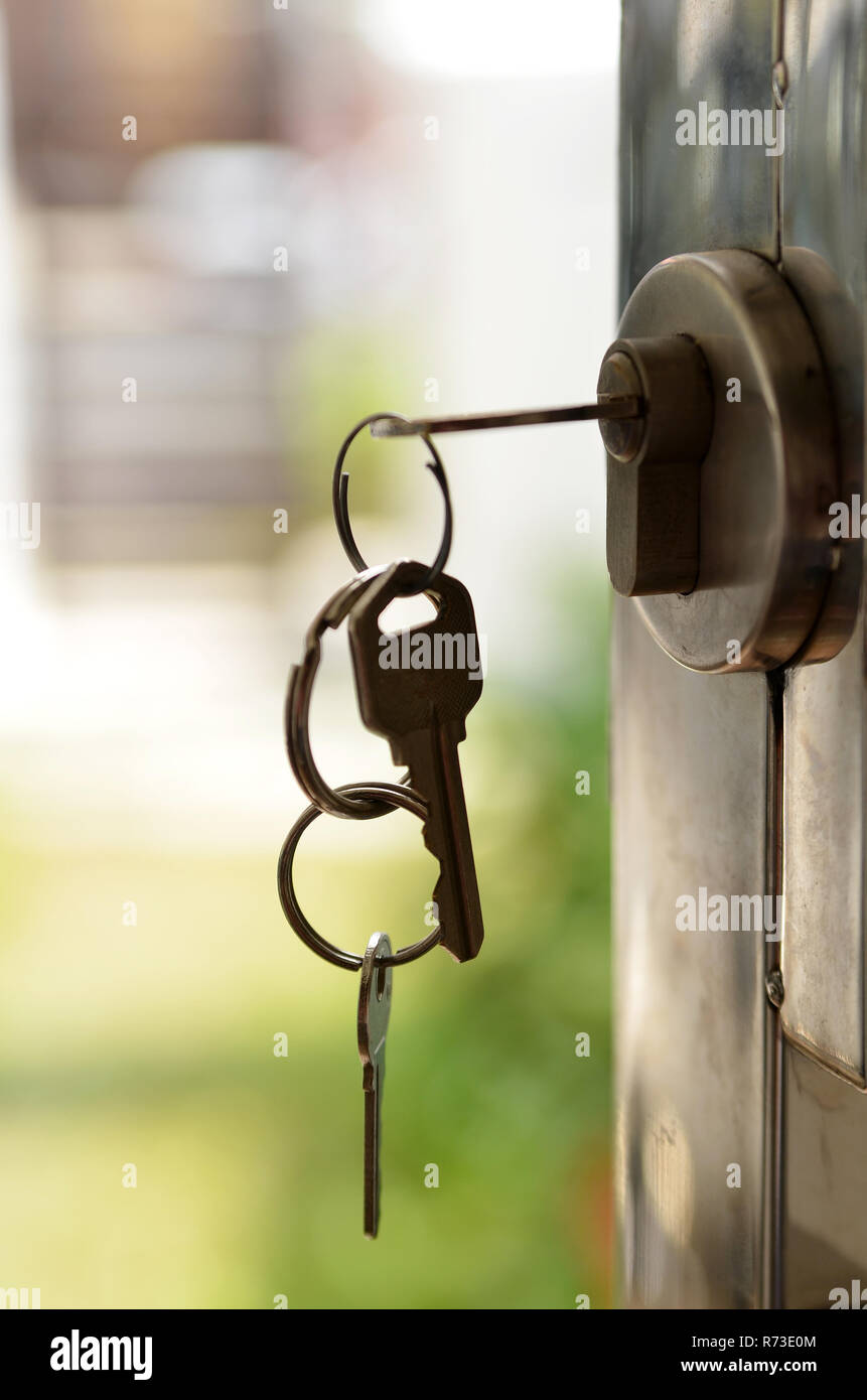 Keys on the door Stock Photo - Alamy