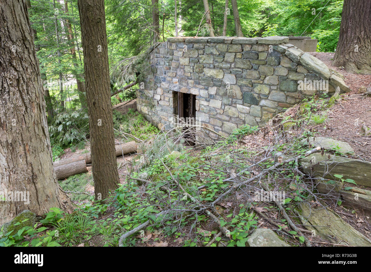 An old stone structure built into the side of a hill along the Pelton ...