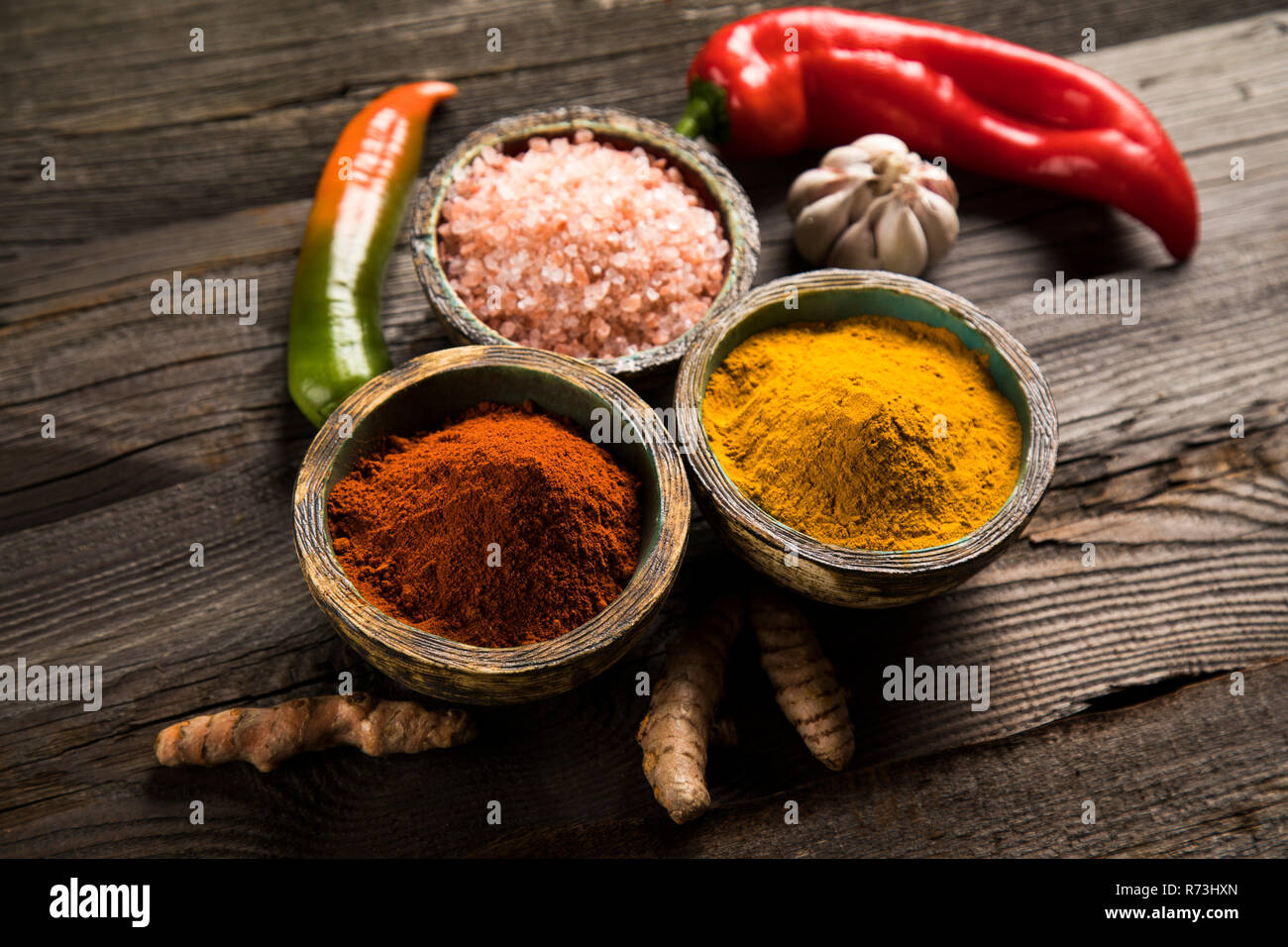 Wooden bowl, Hot spices Stock Photo - Alamy