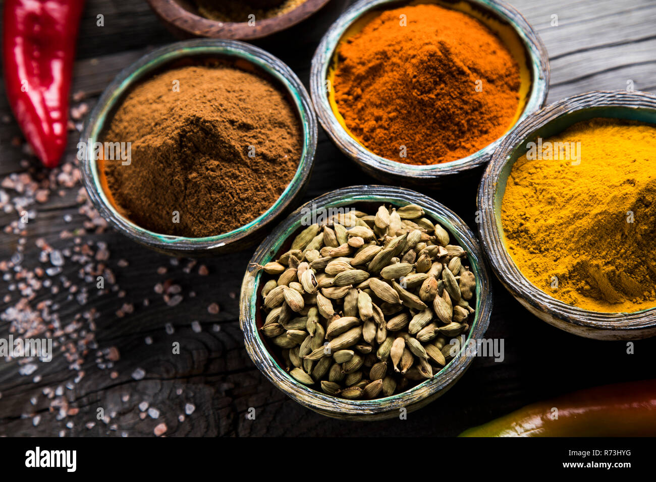 Wooden bowl, Hot spices Stock Photo - Alamy
