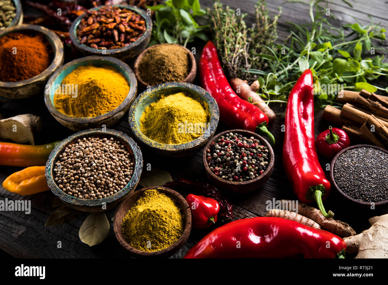 Wooden bowl, Hot spices Stock Photo - Alamy
