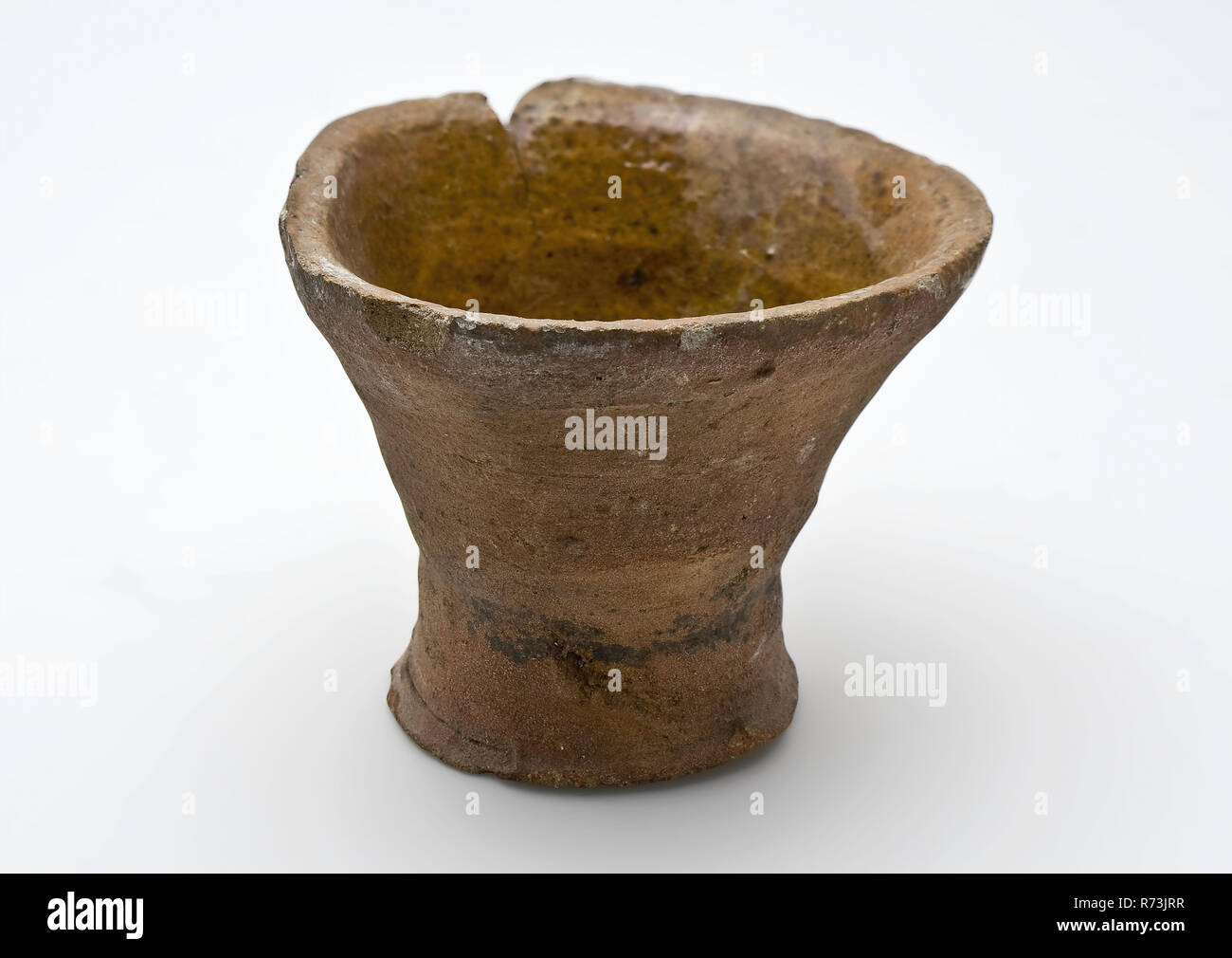 Earthenware, funnel-shaped model with one straight side, on stand foot ...
