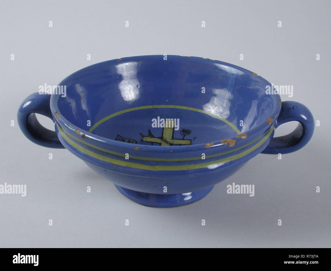 Earthenware pap bowl, blue glazed, yellow cross with Arma Christi ...