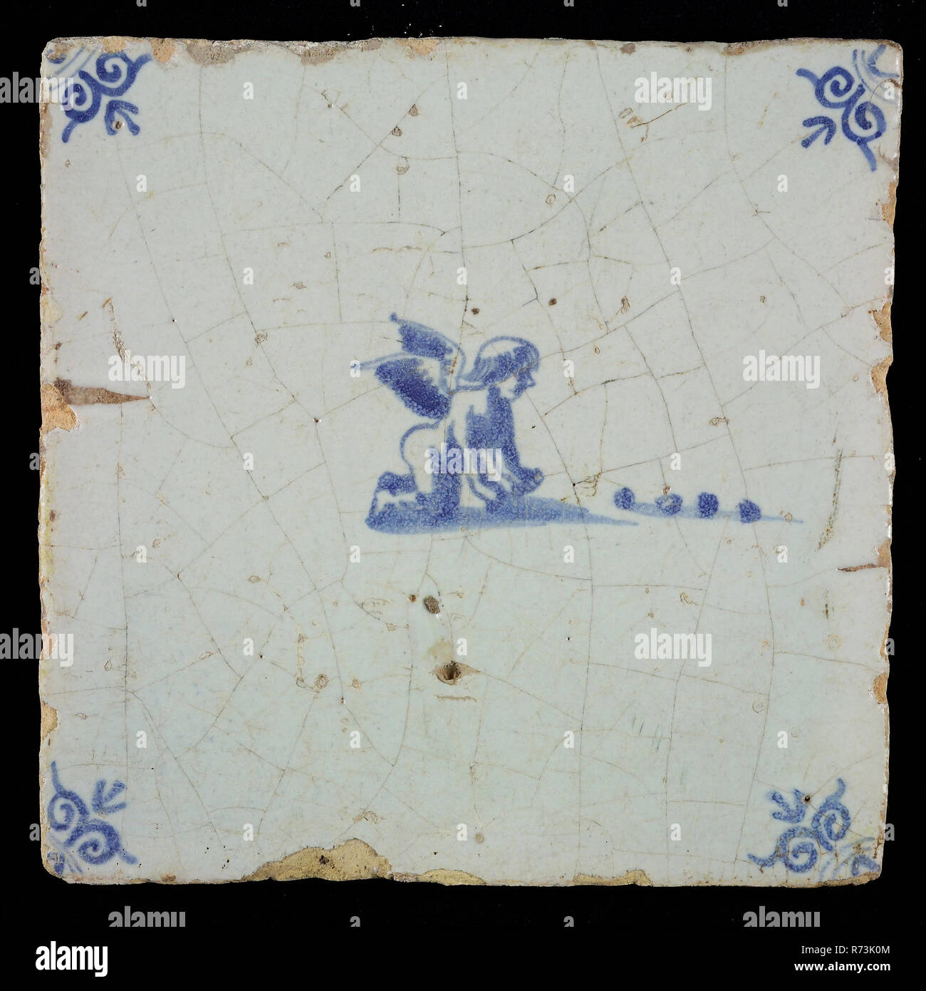 White tile with blue marbling putto; corner pattern ox head, wall tile ...