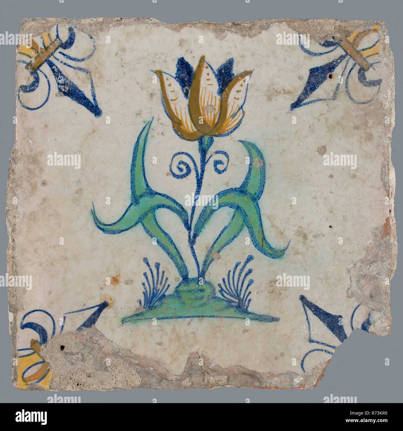 Tile, flower on ground in orange, brown, yellow, green and blue on ...