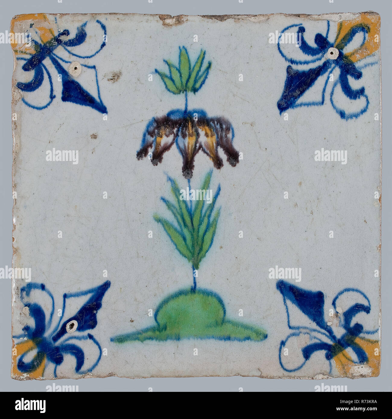 Tile, flower on ground in yellow, brown, green and blue on white ...