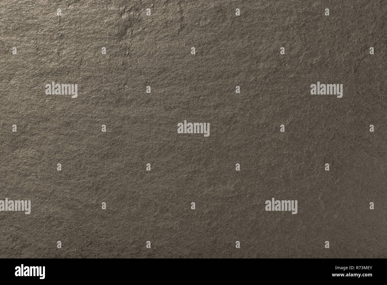 Dark bronze background of natural slate. Texture of brown stone closeup ...