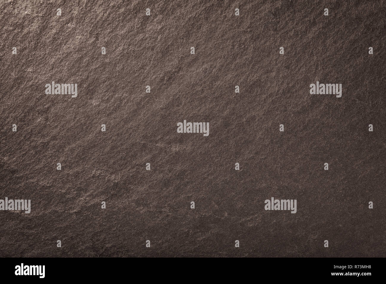 Dark bronze background of natural slate. Texture of brown stone closeup ...