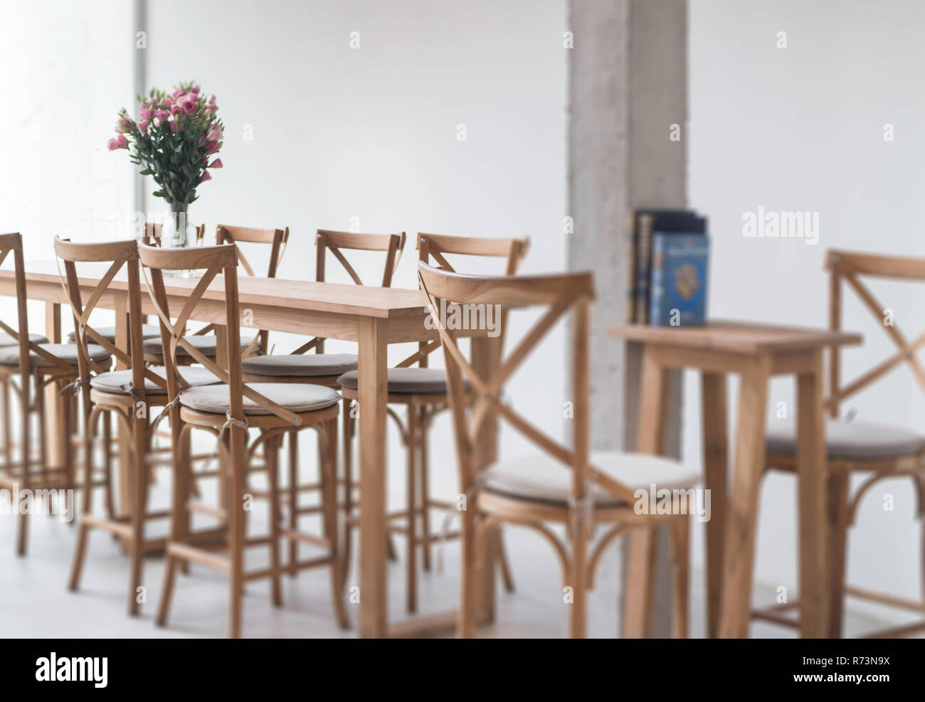 Wooden dining table in coffee shop Stock Photo - Alamy
