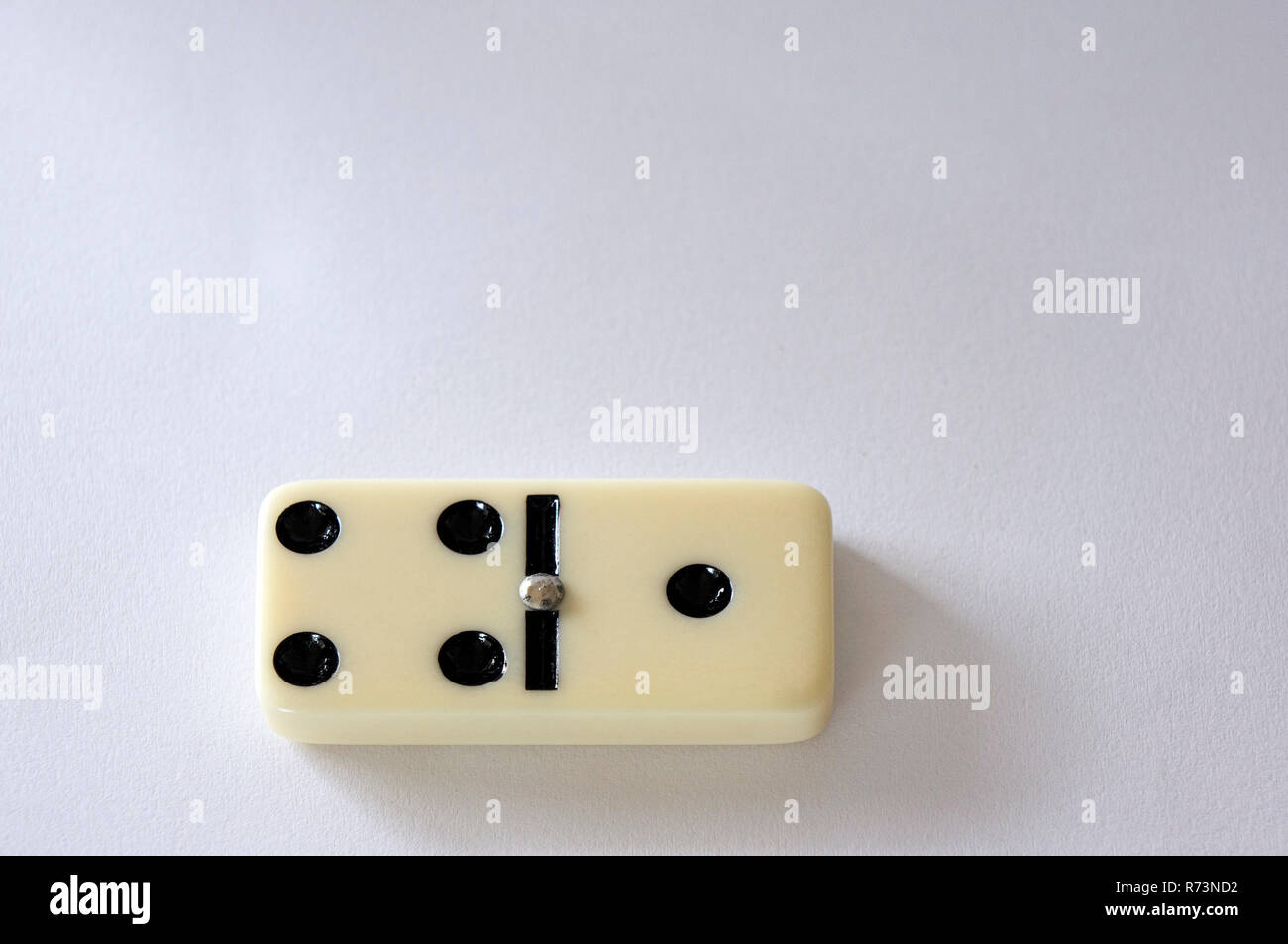 domino white background one four game piece Stock Photo - Alamy